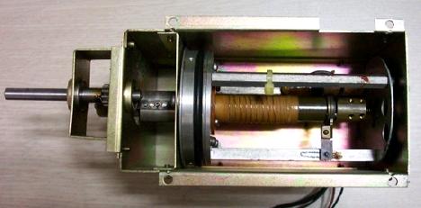 [Left] The VFO board on the top side of the cage.[Right] Collins PTO ...